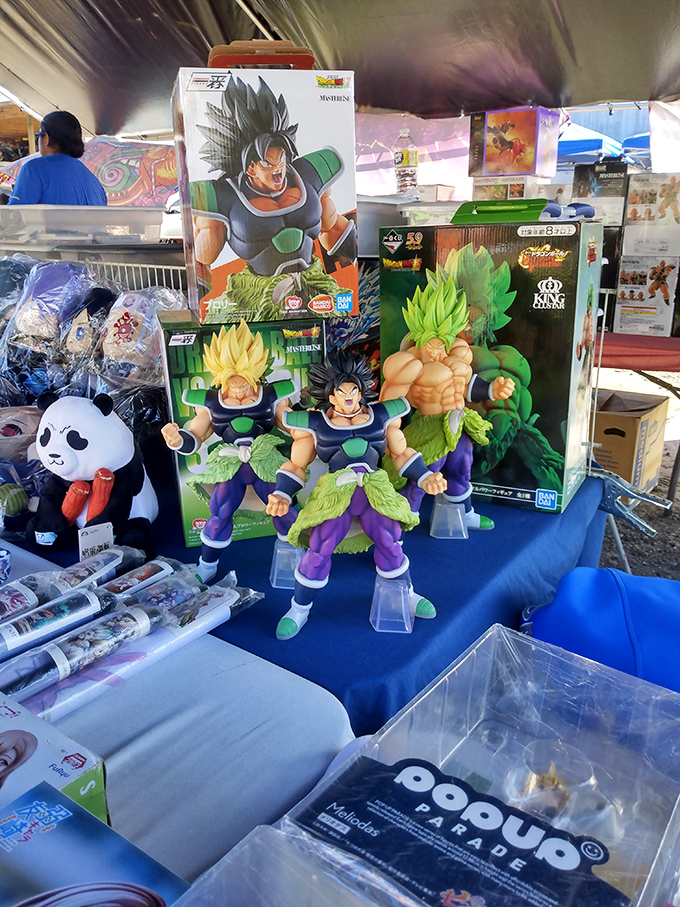 Dragon Ball collectibles stand guard at this vendor's stall. Who knew you could find Super Saiyan bargains between the produce and pottery?