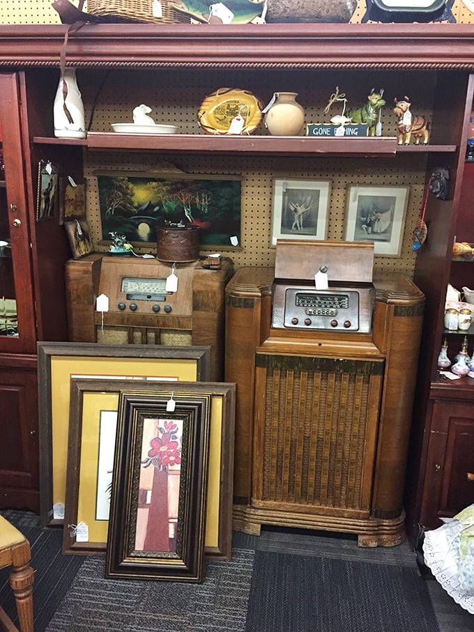 Vintage radios and console stereos wait patiently for their next home. These aren't just antiques&mdash;they're time capsules with dials and wooden cabinets.