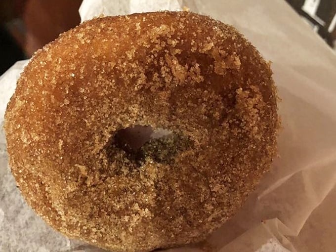 Golden-brown perfection with that signature cinnamon-sugar coating. One bite of this apple cider donut and you'll understand why people make pilgrimages here.