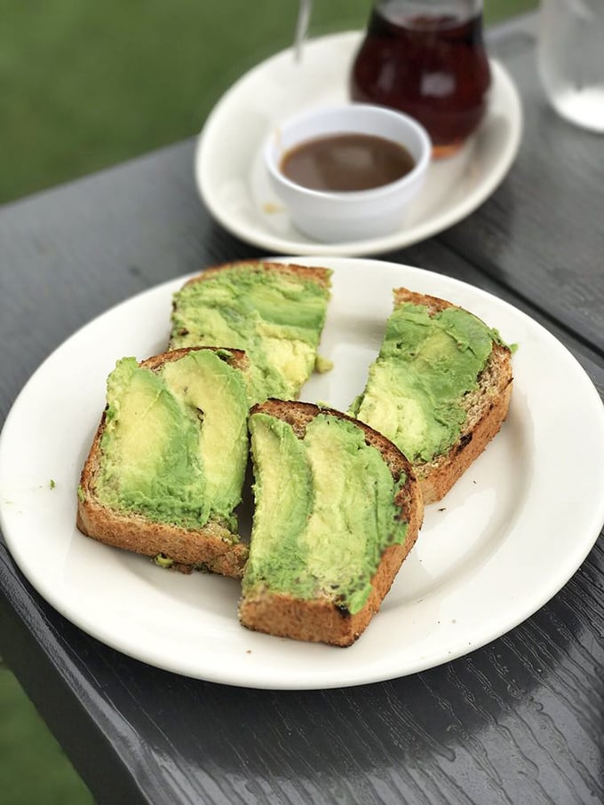 Three perfect slices of avocado toast that prove sometimes the simplest pleasures are the most satisfying &ndash; no fancy garnishes needed.