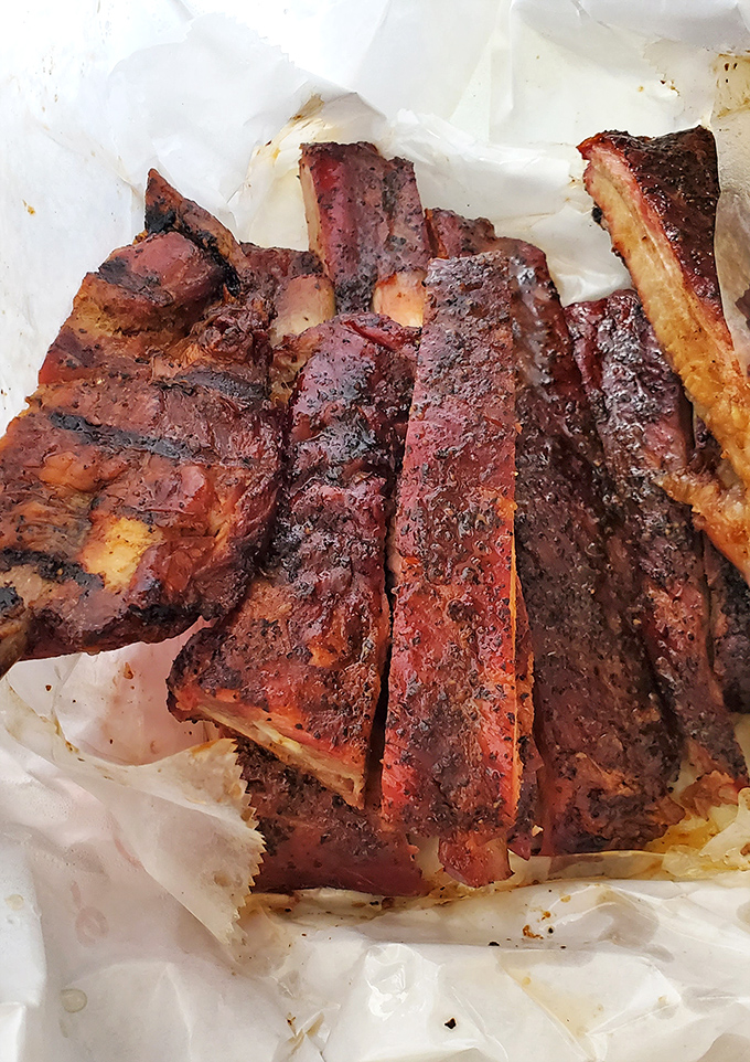These ribs have achieved that perfect balance between tender surrender and satisfying chew that defines barbecue greatness.