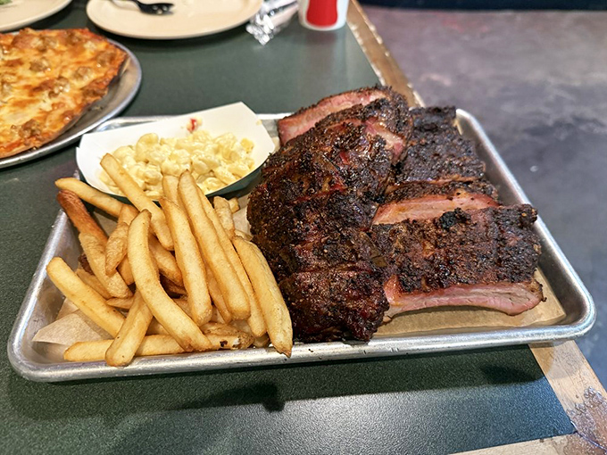 Behold the beef ribs in their bark-crusted glory! These aren't just ribs&mdash;they're prehistoric monuments to the art of smoking meat.