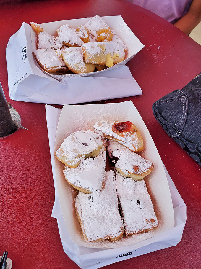 Powdered sugar paradise! These beignets aren't just desserts&mdash;they're pillowy clouds of fried perfection that'll have you planning your next visit before finishing.
