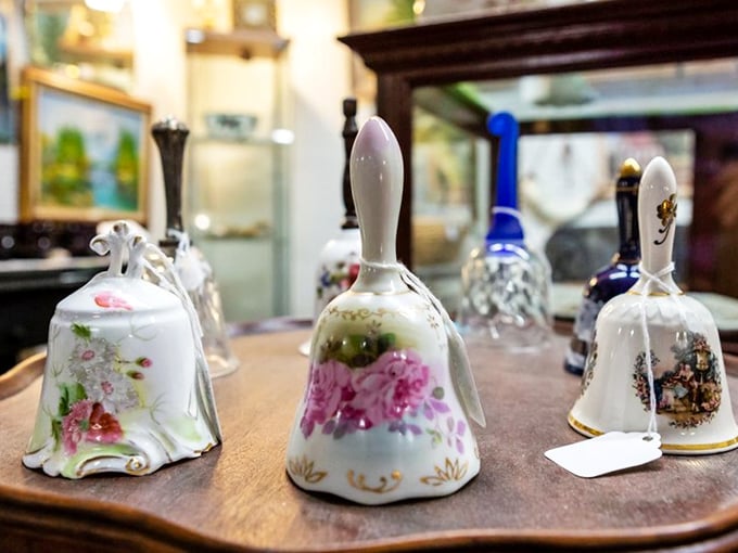 Delicate porcelain bells with hand-painted floral designs sit patiently, waiting for someone to give them voice again after decades of silence.