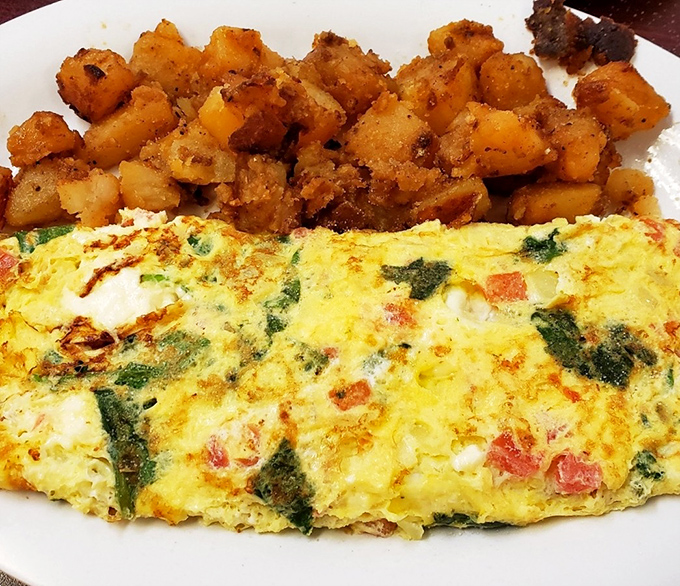 This veggie-packed omelet with perfectly crisped home fries isn't just breakfast&mdash;it's edible therapy that makes Monday mornings bearable again.