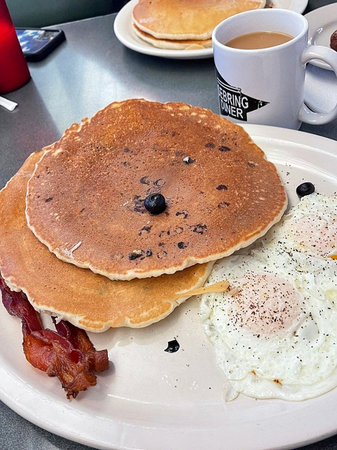 Blueberry pancakes that could make your grandmother jealous, paired with perfectly crisp bacon and eggs. The breakfast trinity, executed flawlessly.