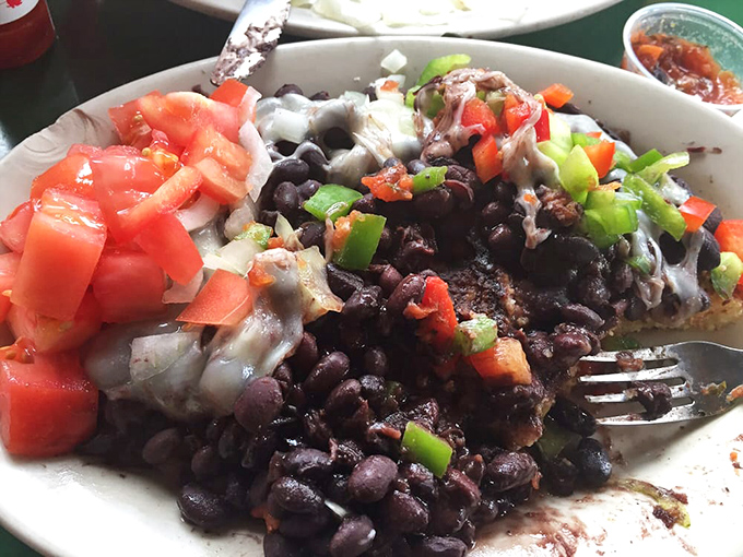 The legendary black bean corn cake in its full glory&mdash;where beans, fresh veggies, and melted cheese create a texture symphony that haunts your dreams.