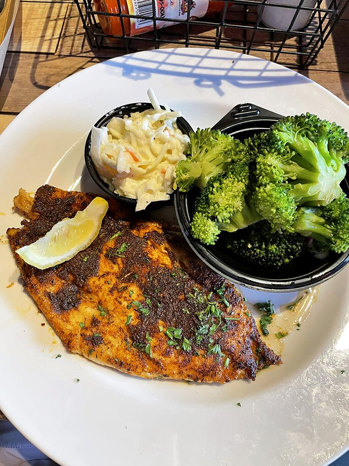 Blackened grouper perfection: that dark, spice-crusted exterior giving way to pearly white fish. The broccoli's just there to make you feel virtuous.