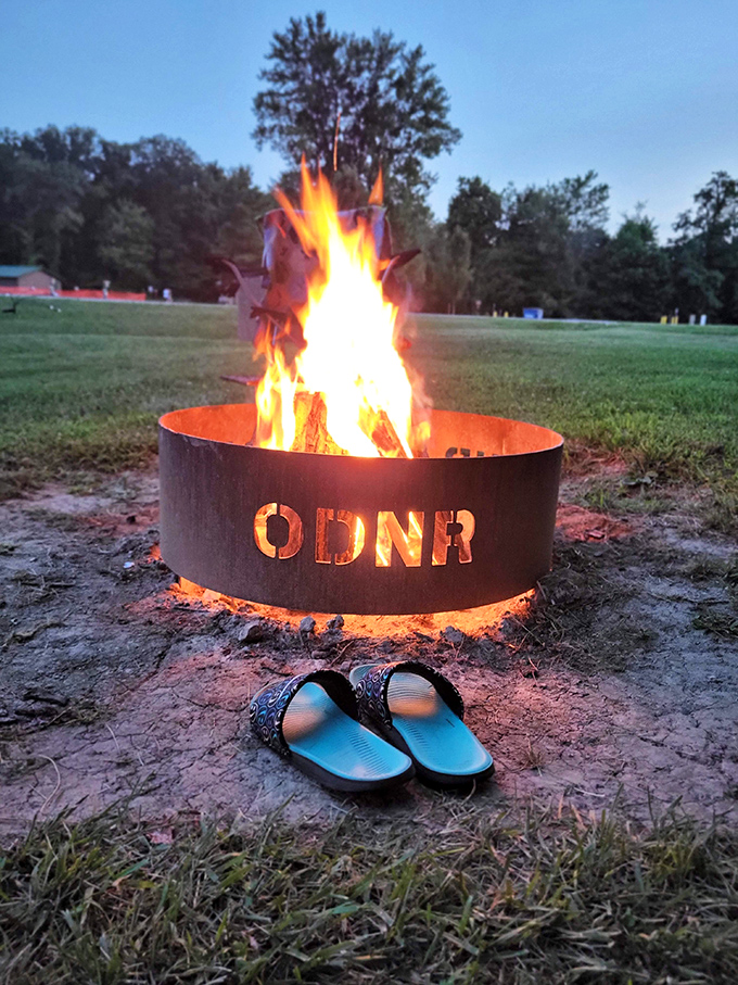 Campfire therapy in session. Nothing soothes the soul like watching flames dance while your flip-flops stand guard.