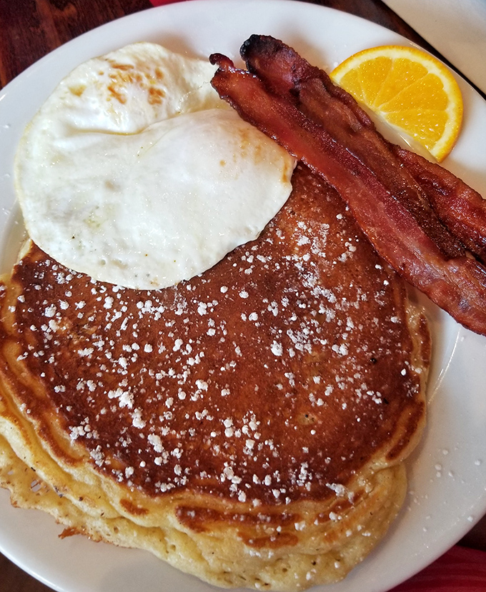 Golden pancakes dusted with powdered sugar, perfectly cooked eggs, and bacon that strikes the ideal balance between crisp and chewy. The breakfast trifecta!