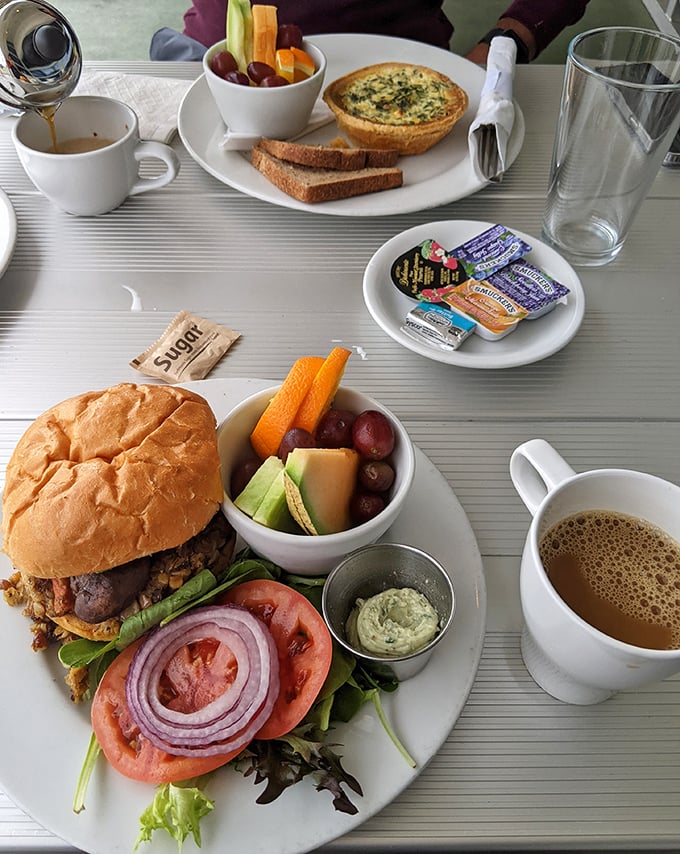 Breakfast perfection on a plate: a quiche that's fluffier than cloud nine, paired with fresh fruit that tastes like it was picked moments ago.