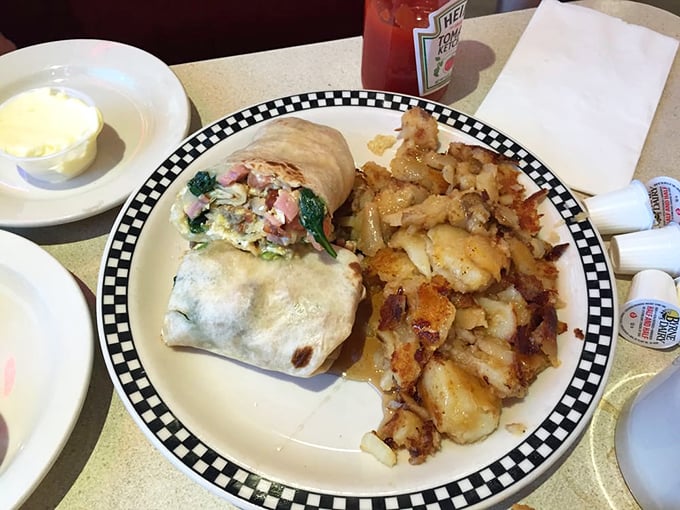 This isn't just breakfast &ndash; it's a morning masterpiece. That omelet practically demands its own zip code, while those home fries deserve a standing ovation.