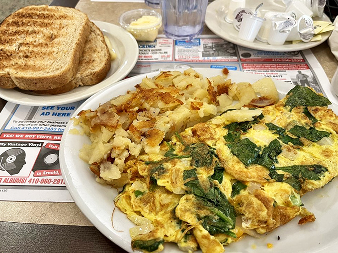 Behold the spinach omelet masterpiece, fluffy as a cloud and packed with garden-fresh goodness that delivers pure satisfaction.