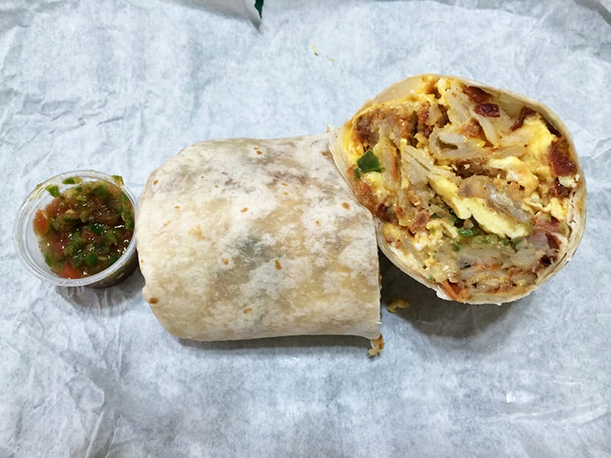Behold the legendary breakfast burrito in all its glory&mdash;eggs, potatoes, cheese, and meat wrapped in tortilla perfection, with that famous salsa standing guard.