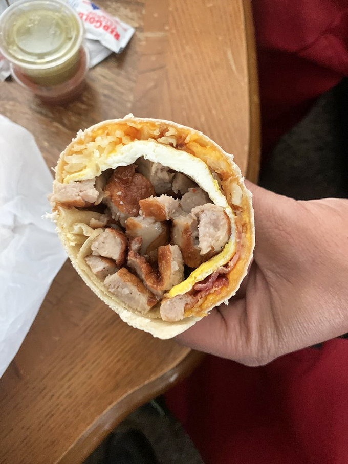 Behold the breakfast burrito in all its glory! Eggs, meat, and potatoes wrapped in a tortilla hug that makes Monday mornings bearable again.