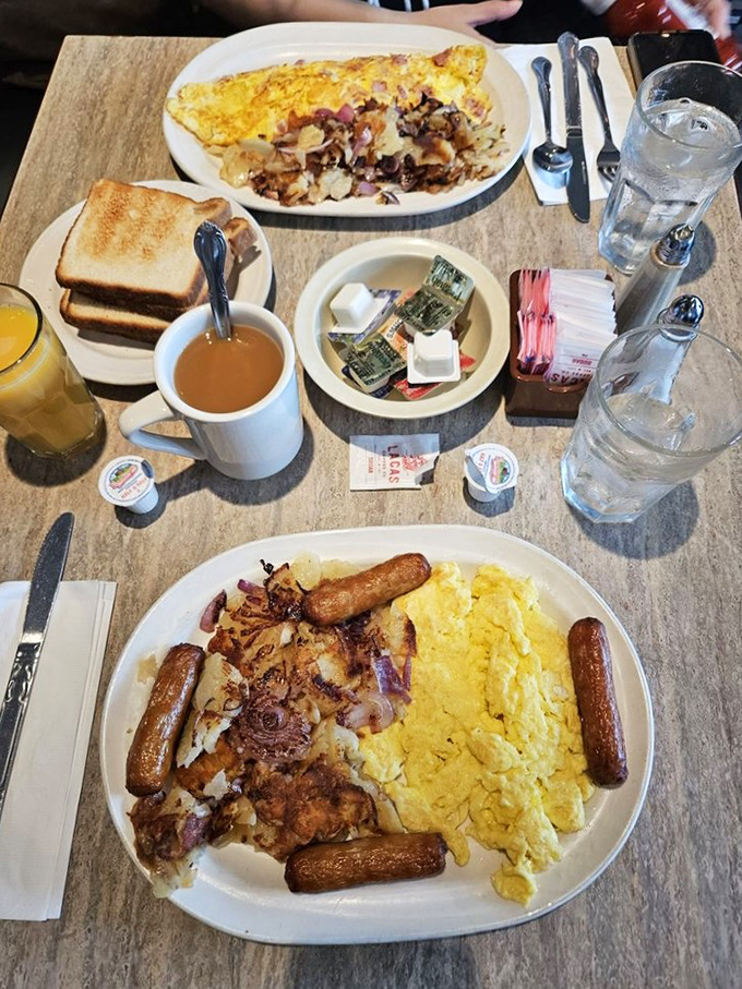 Breakfast nirvana achieved! Golden scrambled eggs, perfectly browned home fries, and sausage links that snap with each bite. This is how champions start the day.