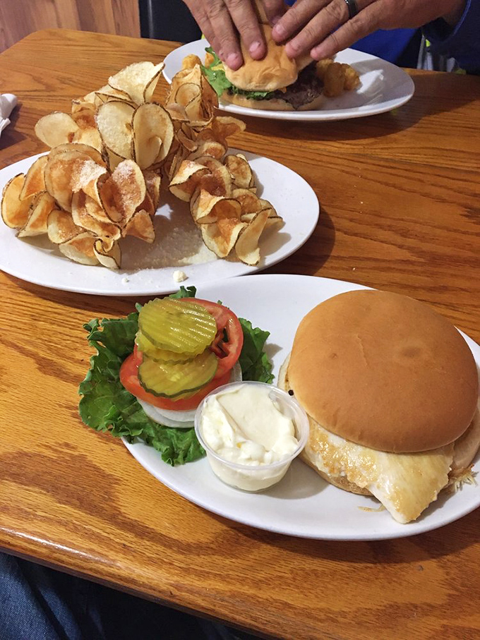 Behold the burger in its natural habitat! Those homemade chips aren't just side characters&mdash;they're scene-stealers worthy of their own spinoff show.