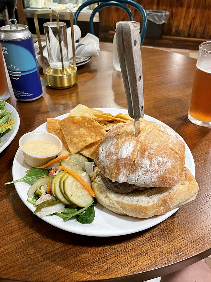 This isn't just a burger&mdash;it's a revelation on a bun. The artisanal bread somehow defies physics by containing all that juicy goodness.