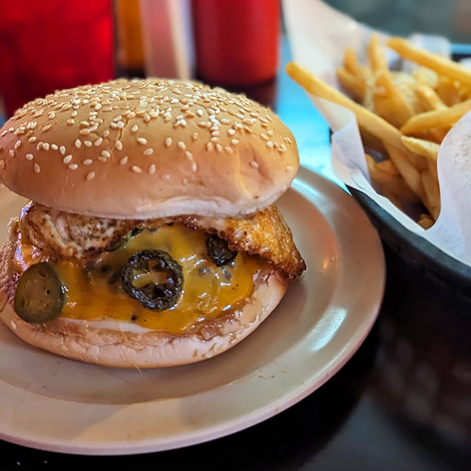 This isn't just a burger&mdash;it's edible architecture. Melted cheese cascades over the patty while pickles and jalape&ntilde;os add a perfect tang.