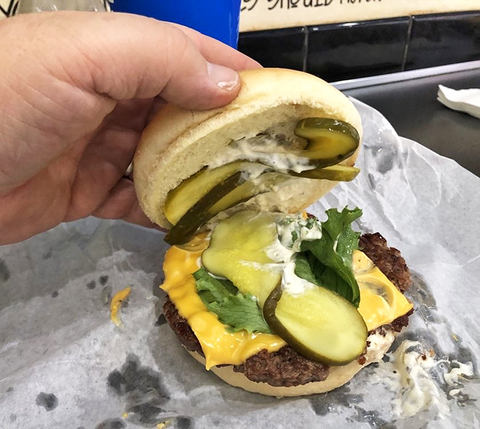 Not all heroes wear capes; some come on a bun with pickles and special sauce. This burger demands a two-handed salute.