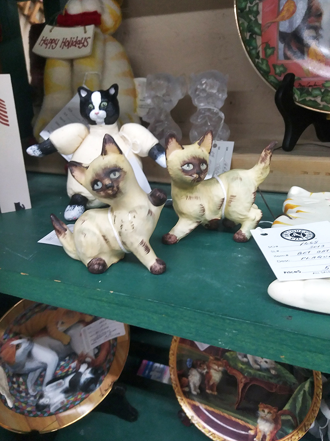 These vintage Siamese cat figurines seem to judge your other purchases with their painted expressions. Kitsch has never been so delightfully judgmental.