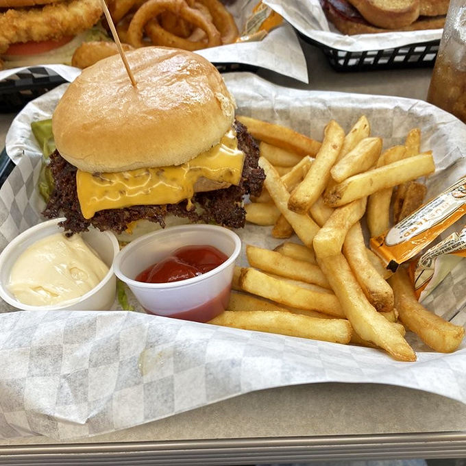 Behold the star of the show: a burger with crispy, lacy edges that extend beyond the bun like a delicious solar eclipse.
