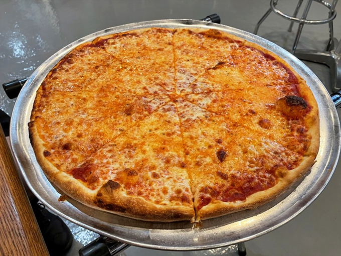 Pizza perfection doesn't need to be complicated. This cheese pie has that golden ratio of sauce to cheese that makes you wonder why you ever tried those fancy toppings.