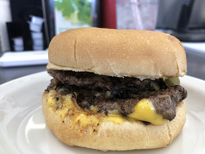 Not so much a cheeseburger as a spiritual experience. That melty cheese cascading over the perfectly seared patty is poetry on a bun.