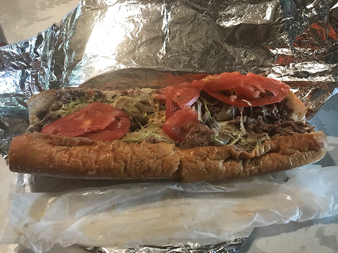 Behold the marriage of beef and bread that makes Philadelphians proud. This isn't just a sandwich&mdash;it's edible architecture with tomatoes as the crown jewels.