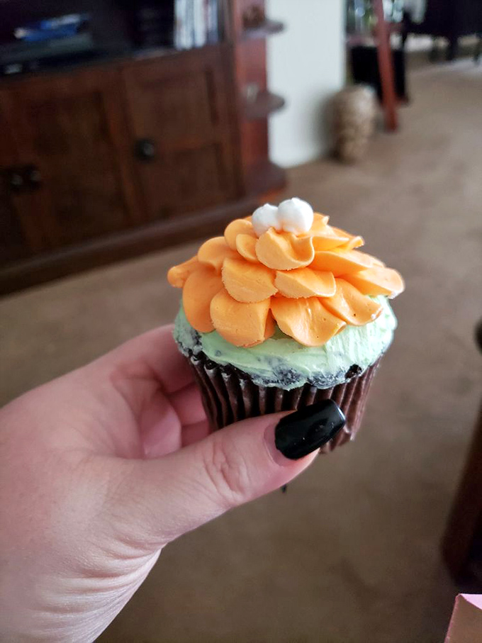 This isn't just a cupcake; it's a floral arrangement you can eat. The mint-orange combo is like springtime decided to throw a party in your mouth.