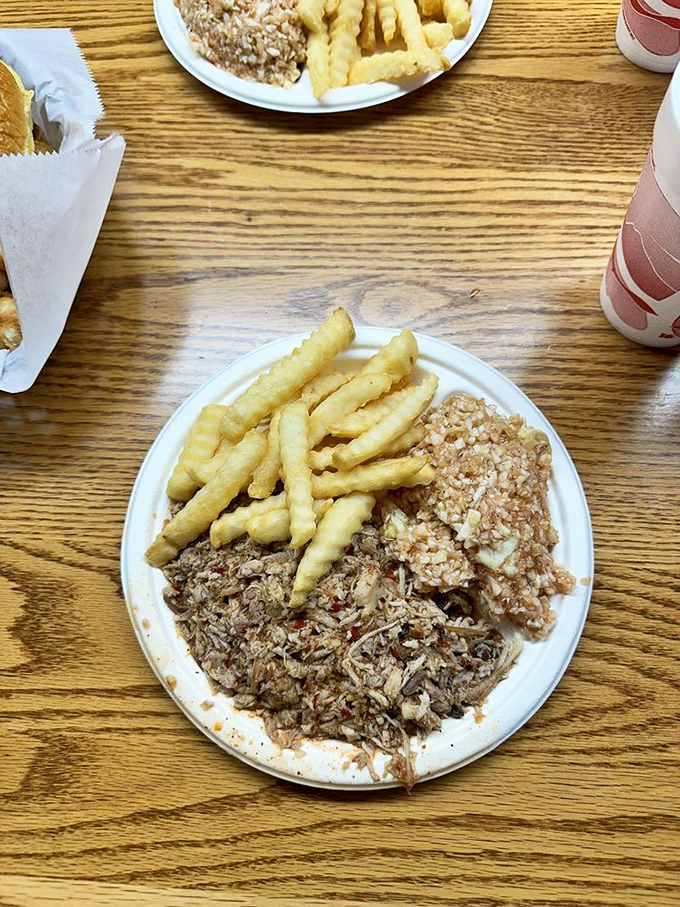 Chopped pork that's been through smoke therapy, paired with golden fries and slaw that brings tang to the party.