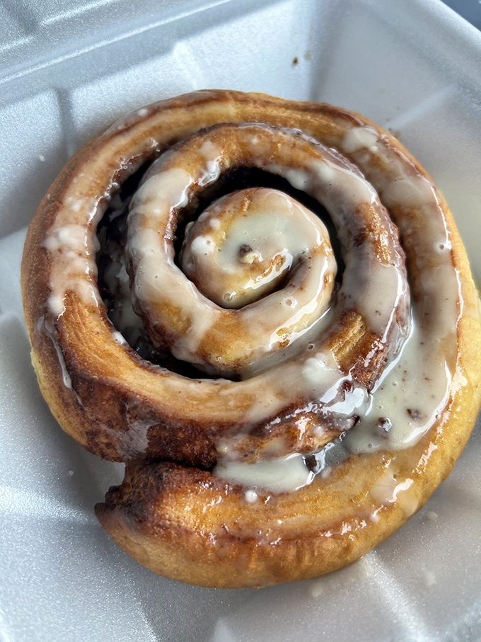 Behold, the crown jewel: a cinnamon roll that makes time stand still. That spiral of doughy perfection drowning in icing is worth every calorie.