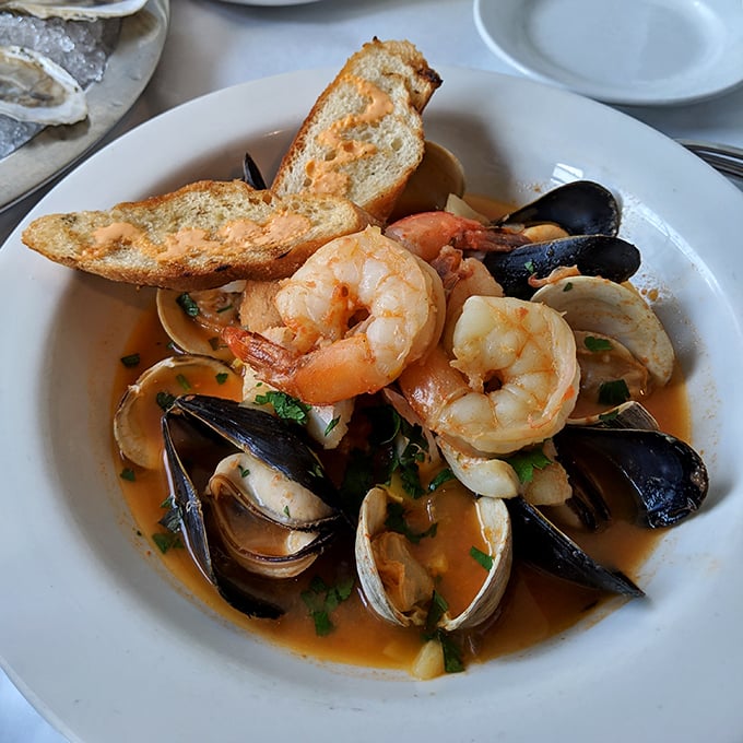 This seafood medley isn't just a dish, it's an underwater reunion where shrimp, mussels and clams party in broth heaven.