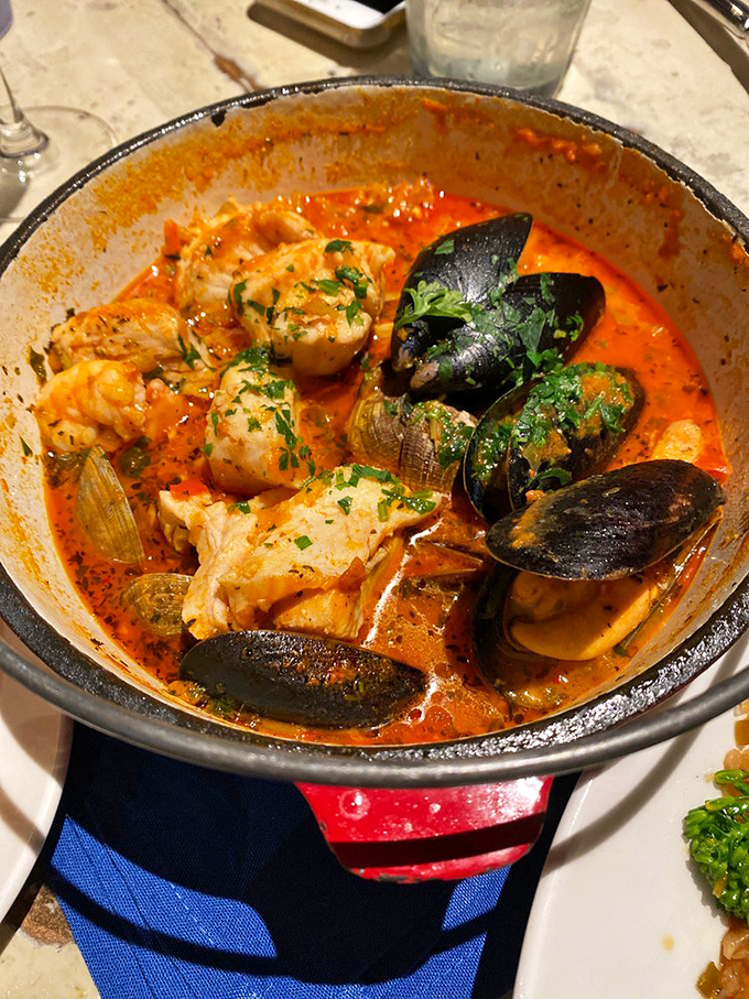 The Iron Pot Cioppino isn't just a stew&mdash;it's a maritime treasure hunt where each spoonful yields a different oceanic jewel.