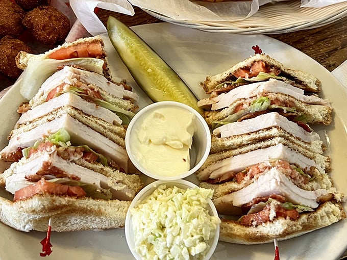 The legendary club sandwich arrives like architecture on a plate &ndash; perfectly stacked layers of goodness with enough filling to make you wonder how to approach it.