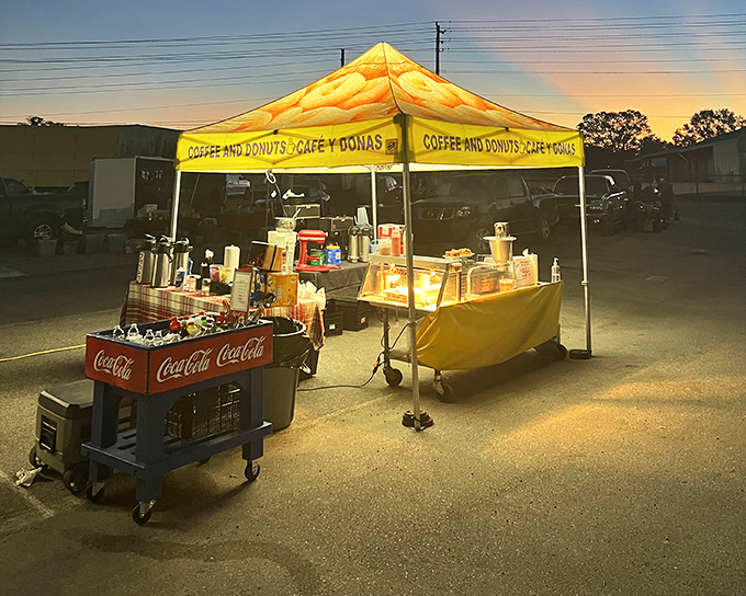 Weekend treats! The coffee and donuts stand illuminates the lot like a carnival attraction, proving intermission can be the main event.