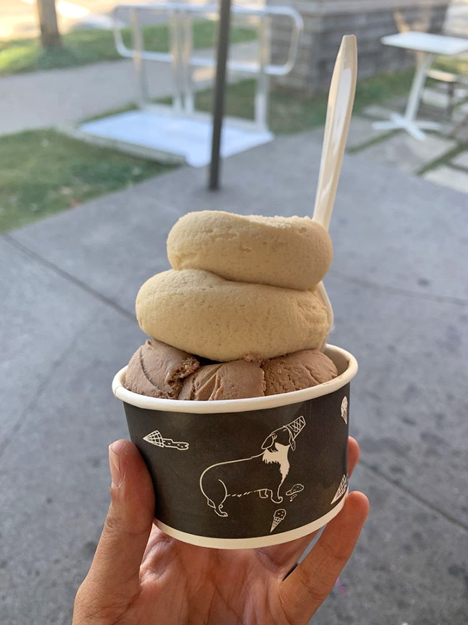 Two scoops of heaven stacked in perfect harmony. That wooden spoon isn't just eco-friendly&mdash;it's your ticket to a moment of pure, unadulterated joy.