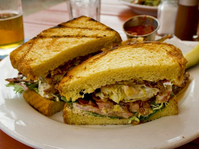 This sandwich isn't just lunch&mdash;it's architecture. Layers of flavor stacked between perfectly toasted bread that somehow defies gravity.