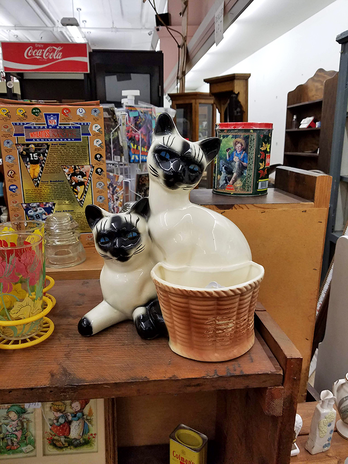 These ceramic felines aren't just decorative&mdash;they're judging your other purchases with those knowing blue eyes. Vintage kitsch at its most charming.