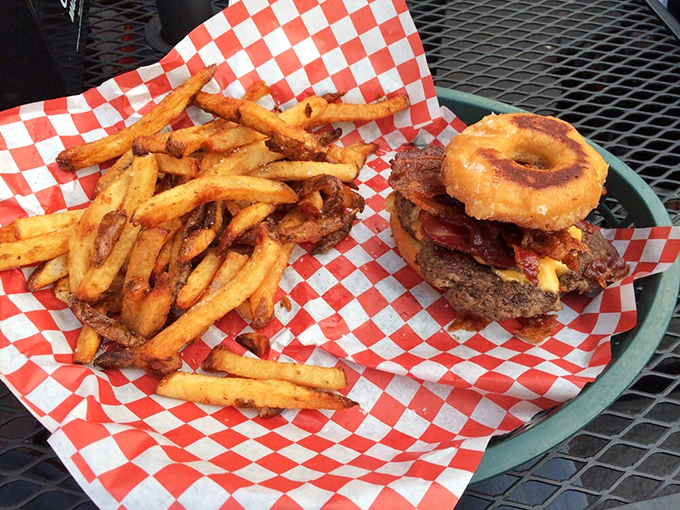 Behold the Donut Sandy in its natural habitat – a burger that dared to dream beyond conventional buns and succeeded magnificently.