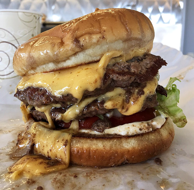 Not so much a burger as a skyscraper of beef and cheese&mdash;this masterpiece requires both hands, several napkins, and absolutely no shame.