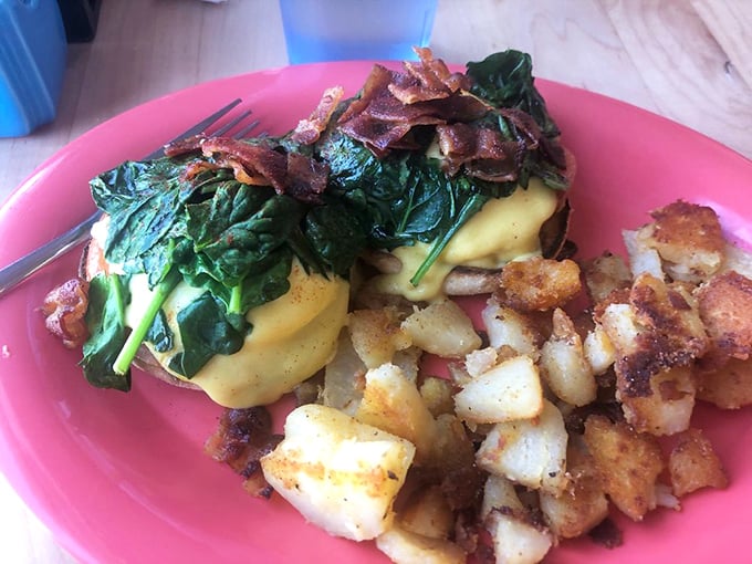 Eggs Benedict gets the royal treatment with fresh spinach and perfectly crisped bacon. Hollandaise sauce that would make Julia Child nod in approval.