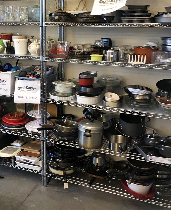 Kitchen archaeology at its finest! From vintage Pyrex to barely-used pressure cookers, these shelves hold the culinary tools of generations past, waiting for new homes.