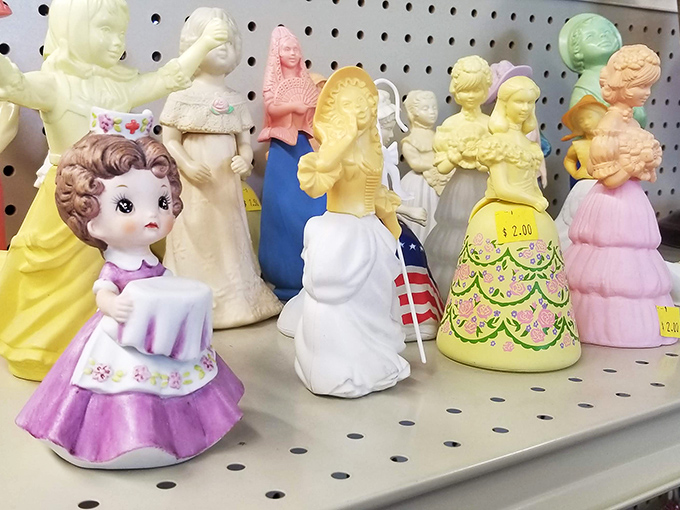 Vintage figurines stand at attention like a porcelain army of forgotten collectibles and childhood memories. 