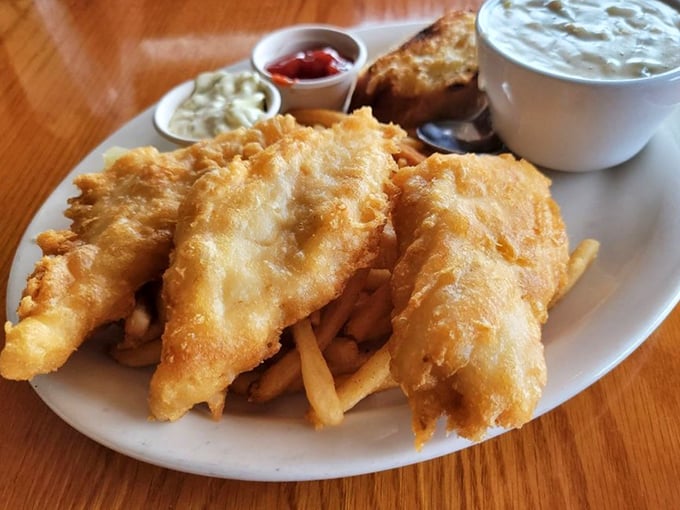 Golden-battered fish that shatters with each bite, paired with crispy fries. The kind of fish and chips that makes British expats weep with joy.