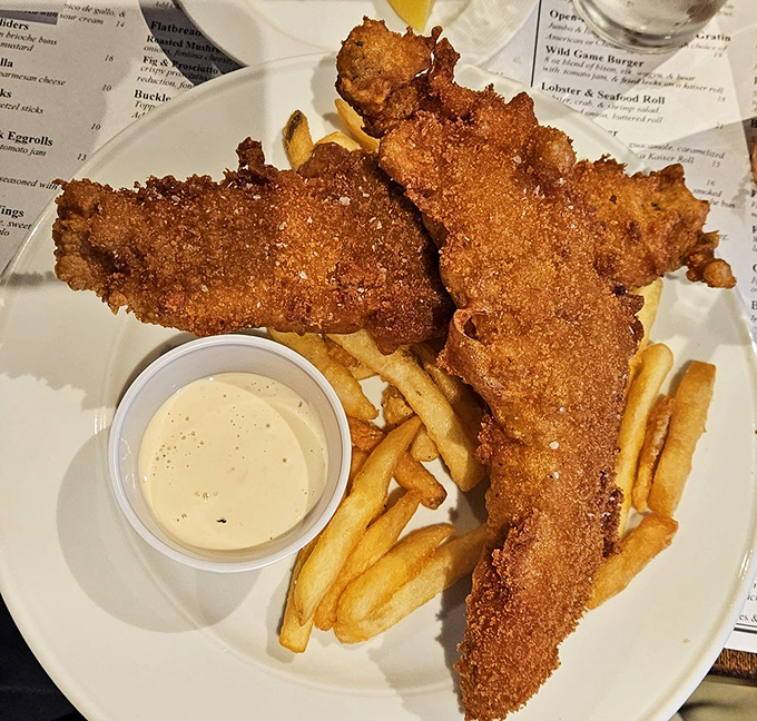 Golden-battered fish that shatters at first bite, paired with fries that achieve that perfect crisp-outside, fluffy-inside nirvana&mdash;the fish and chips here are no mere afterthought.