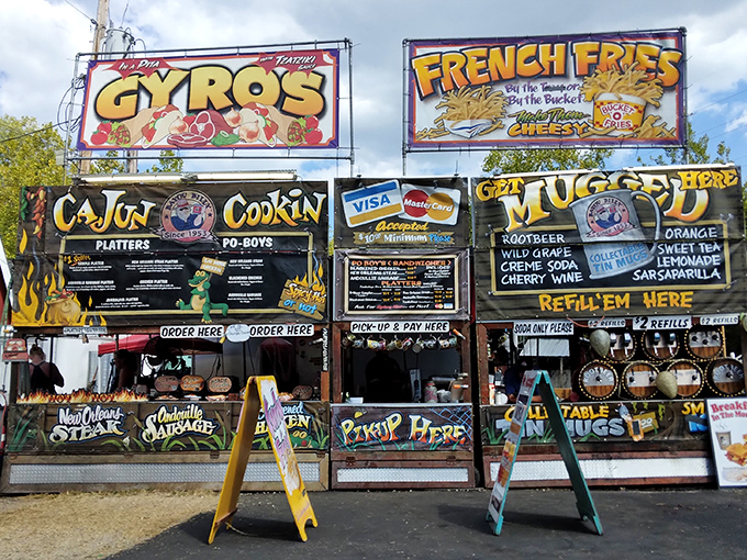 Culinary decisions more complex than some marriage proposals. The "Cajun Cookin'" stand proves that even flea markets understand the importance of proper sustenance between bargain hunts.