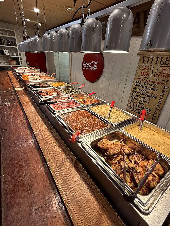 The buffet line stretches like a highway of Southern delights. Each metal tray holds another reason your diet starts tomorrow.
