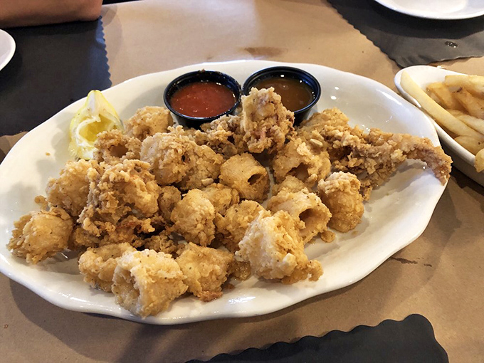 Golden treasures from the deep! This calamari is fried to such perfection that even squid-skeptics find themselves reaching for just one more.