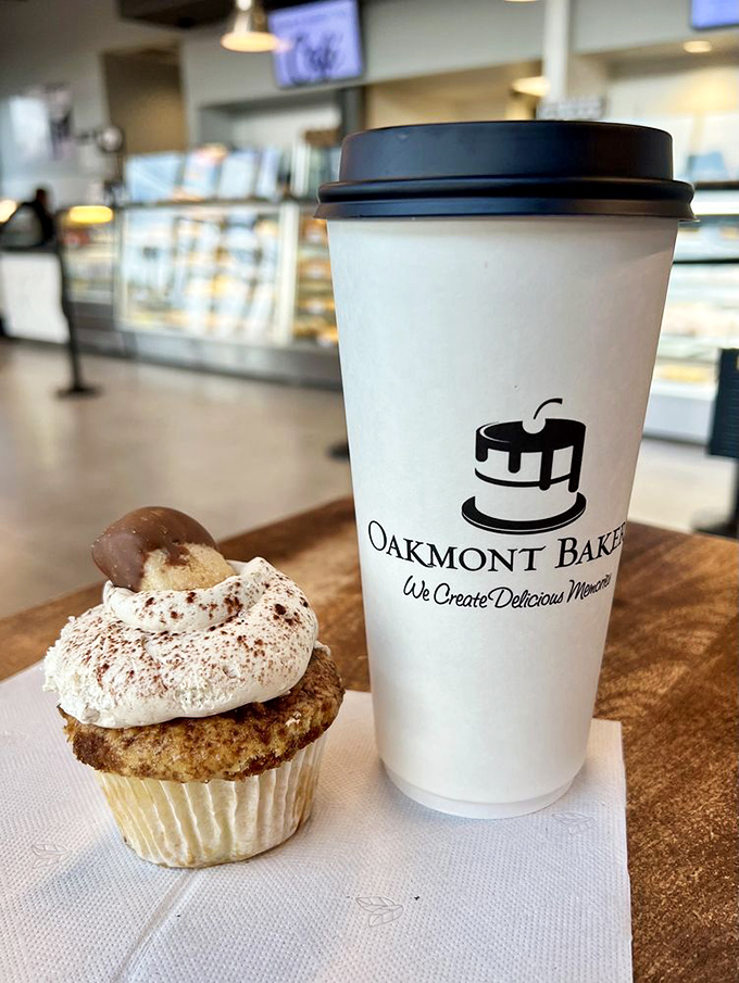 Coffee and cupcake: name a more iconic duo. This cinnamon-topped beauty isn't just a pastry—it's a reason to reschedule your morning meetings.